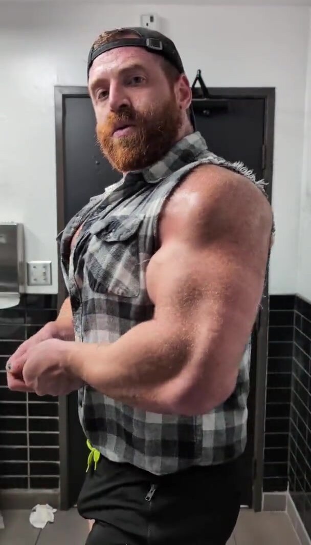 Ginger Muscle Guy Flexing Biceps