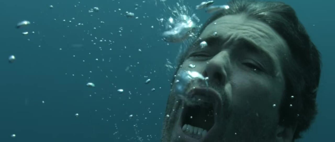 Barefaced Clothed Man Drowning Underwater