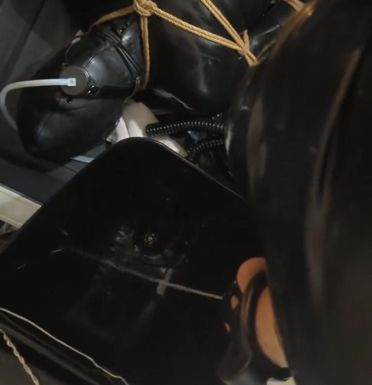 Tied Rubber Gimp Drinks Piss From Dick In Chastity